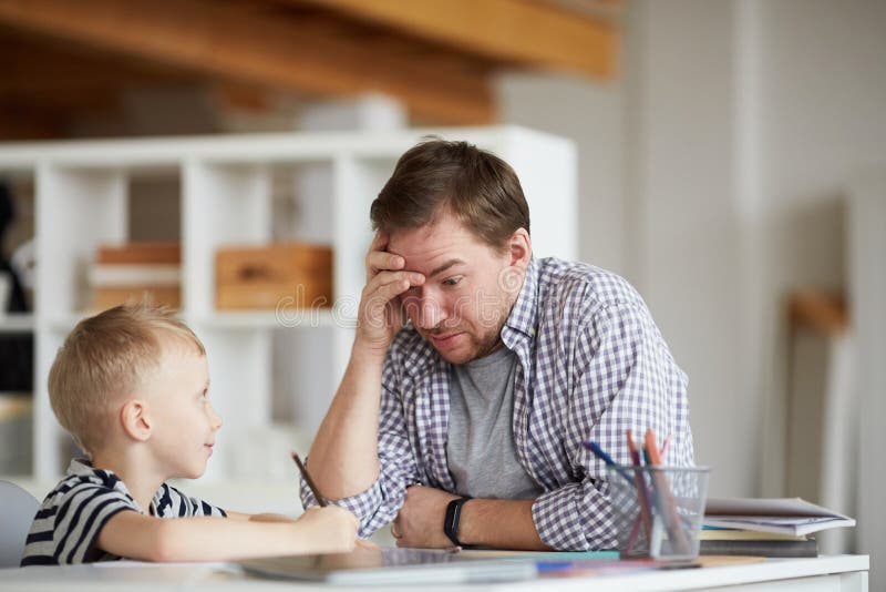 Father Puzzled with Sons Home Task Solution Stock Image - Image of ...