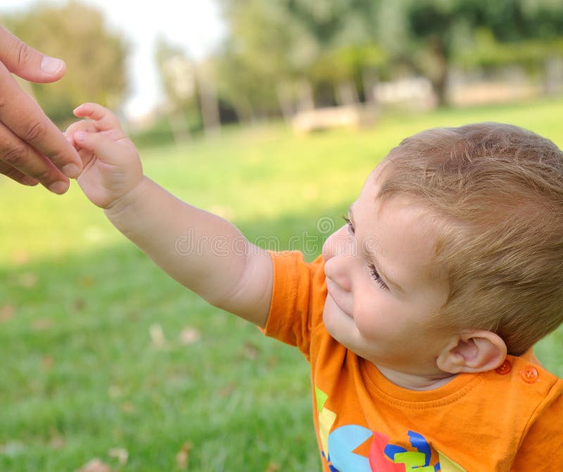 Father Reaching Out To His Son Stock Image - Image of baby, orange ...