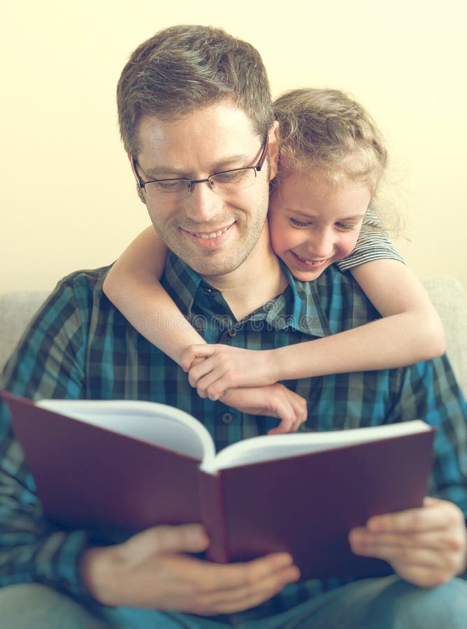 Father Reading Book with Daughter. Stock Image - Image of girl ...