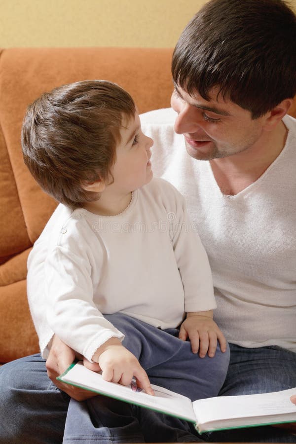 Father Reading Book To Daughter Stock Image - Image of caucasian ...