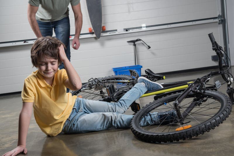 Father Running To Help Wounded Boy Falling Off Bike Stock Photo - Image ...