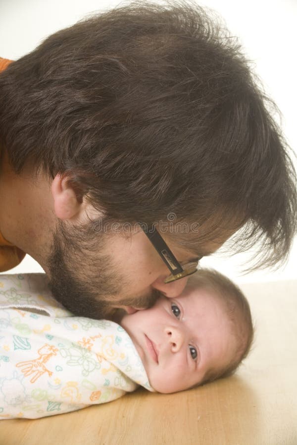 A father s kiss stock photo. Image of blanket, hands, communicate - 5199556