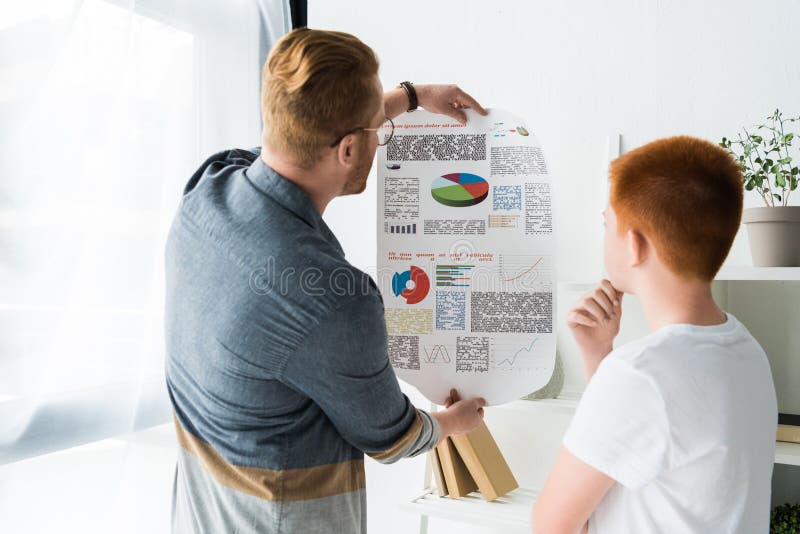 Father Showing Diagram To Pensive Son Stock Image - Image of ...