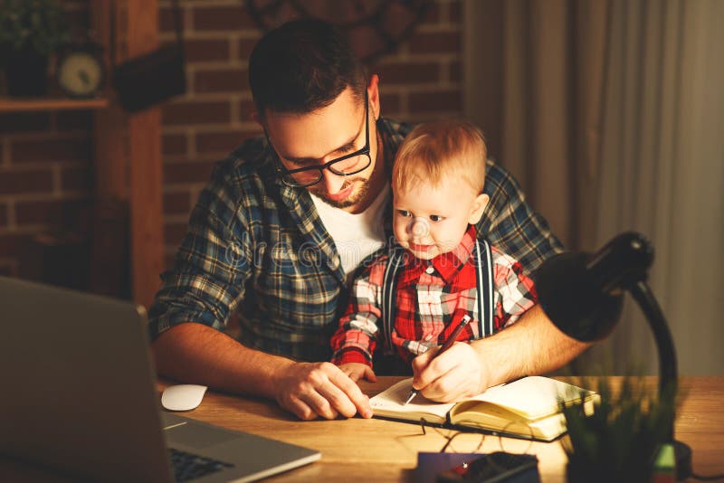 Father and Son Baby Work at Home at Computer in Dark Stock Photo ...