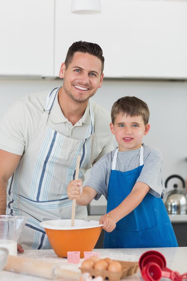 Father and Son Baking Cookies Together Stock Photo - Image of family ...