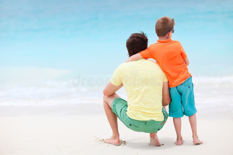 Father and son at beach stock image. Image of parent - 25219821