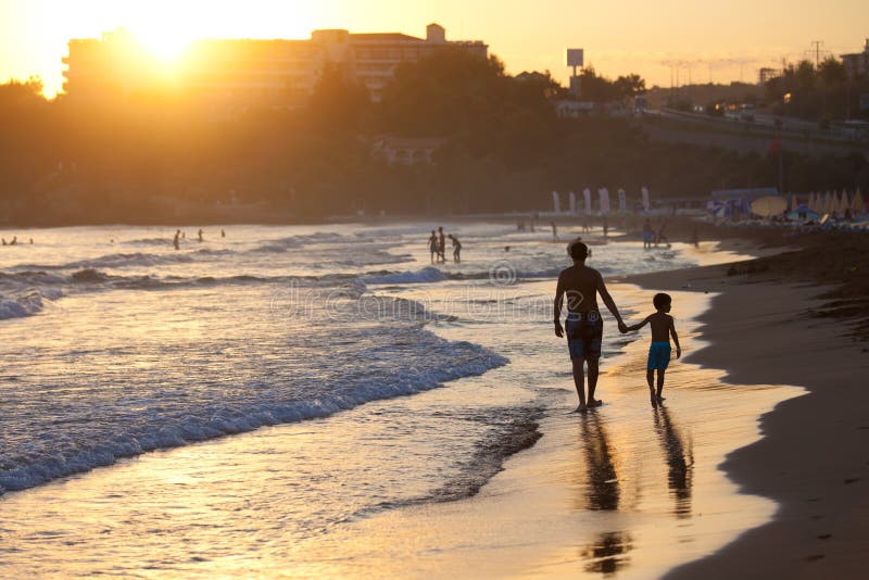 Father and Son on the Beach at Sunset Stock Photo - Image of travel ...