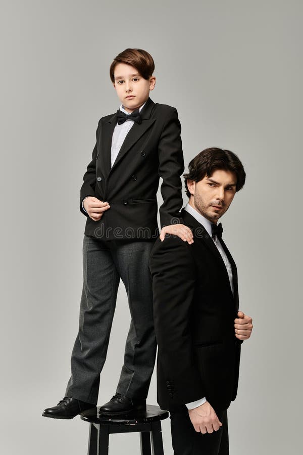 A father and son, both in stock image. Image of standing - 332631151