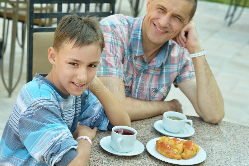 Father with Son at Breakfast Stock Photo - Image of lifestyle, pleasure ...
