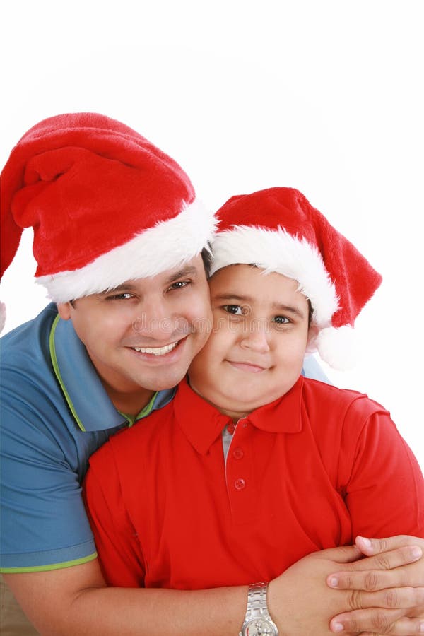 Father and Son with Christmas Hats Stock Image - Image of together ...