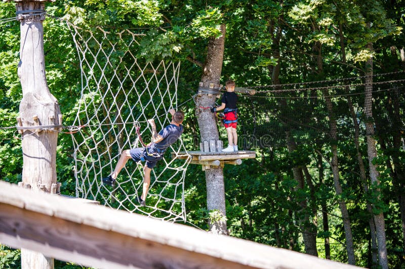 Father with Son Climbing a Net during Obstacle Course in Boot Camp ...