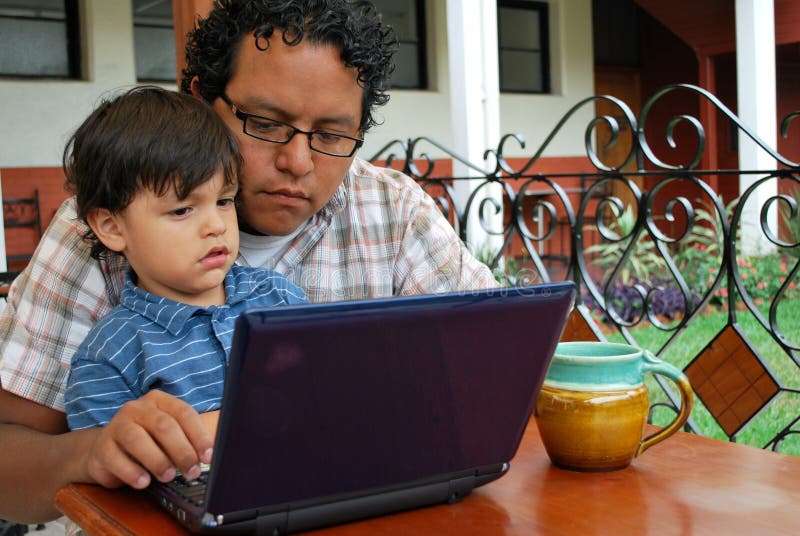 Father and Son on Computer Together Stock Image - Image of campus ...