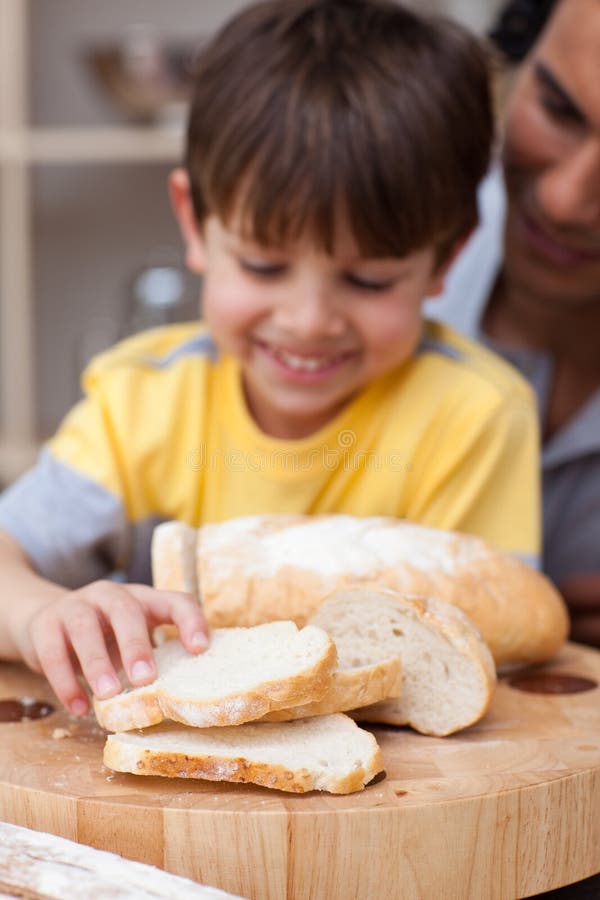 Father and Son Cutting Bread Stock Image - Image of cooking, happy ...