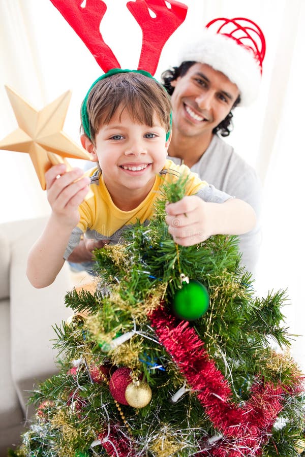 Father and Son Decorating a Christmas Tree Stock Image - Image of green ...