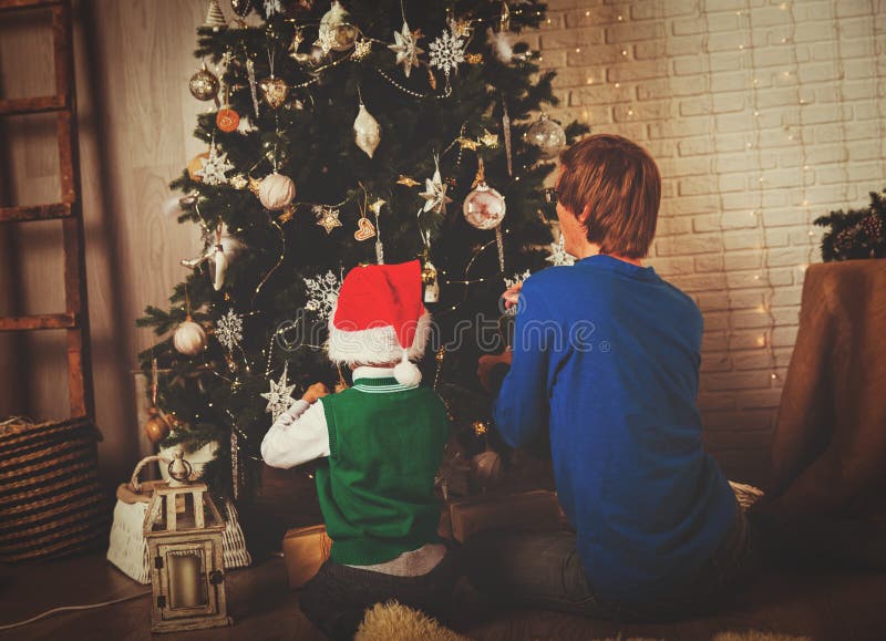 Father and Son Decorating Christmas Tree Stock Image - Image of father ...