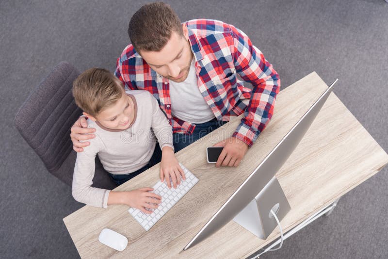 Father and Son with Desktop Computer Stock Image - Image of young ...