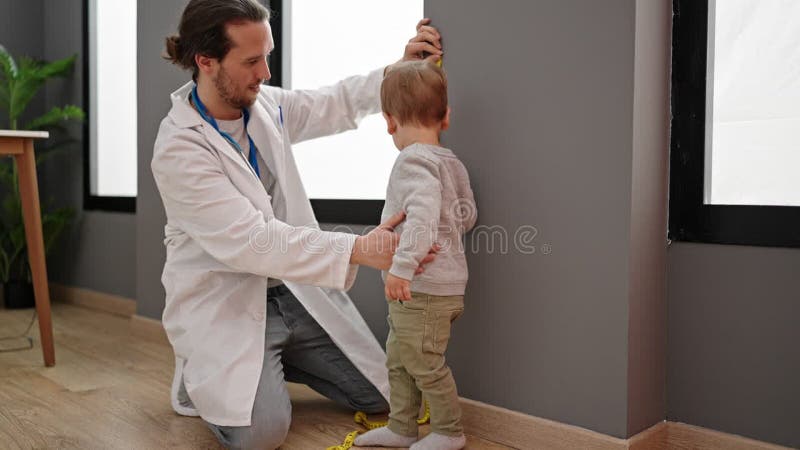 Father and Son Doctor Measuring Kid at Clinic Stock Video - Video of ...