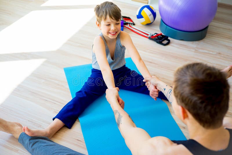 Father and Son Doing Sit Ups Stock Photo - Image of strong, smile: 99010266