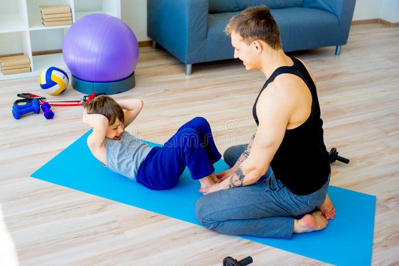 Father and Son Doing Sit Ups Stock Image - Image of female, male: 99010373