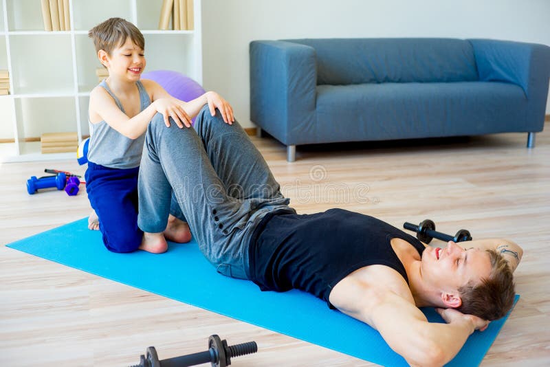 Father and Son Doing Sit Ups Stock Photo - Image of father, fitness ...