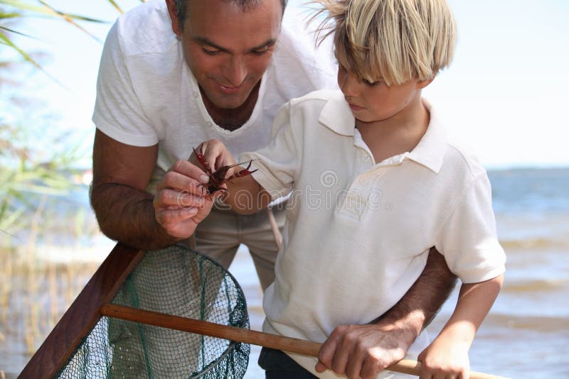 Father and son fishing stock image. Image of fisherman - 35203955
