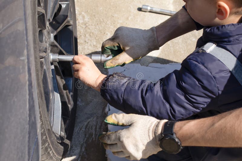 Father and Son are Fixing the Car. the Son Helps the Dad. Happy Father ...