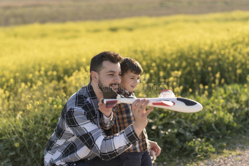 Father and Son Flying Airplane Toy in Spring Day Stock Image - Image of ...