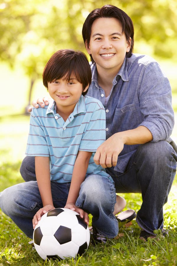 Father and Son with Football Stock Photo - Image of camera, asian: 55893100