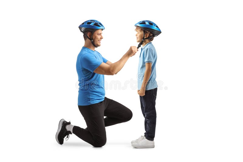 Father and Son Getting Ready for a Bicycle Ride and Putting on Helmets ...