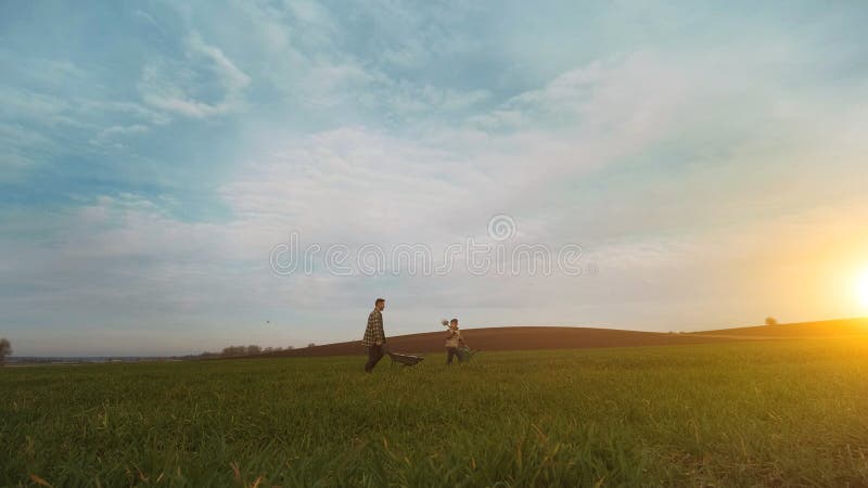 The Father and Son are Going To Work at the Field. Stock Photo - Image ...
