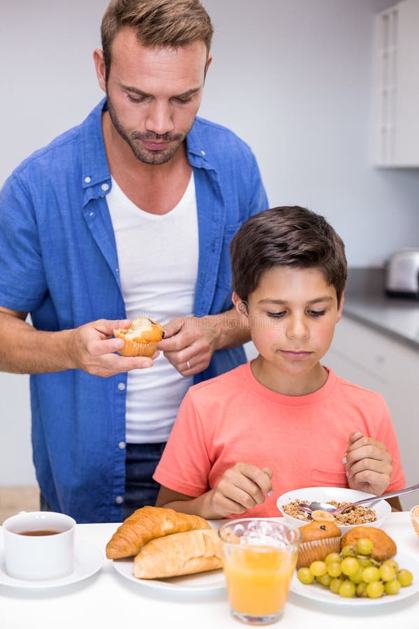 Father and Son Having Breakfast Stock Image - Image of child, cereal ...