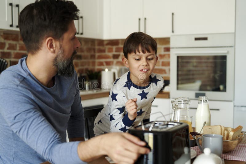 Eating breakfast with dad stock photo. Image of healthy - 223781264