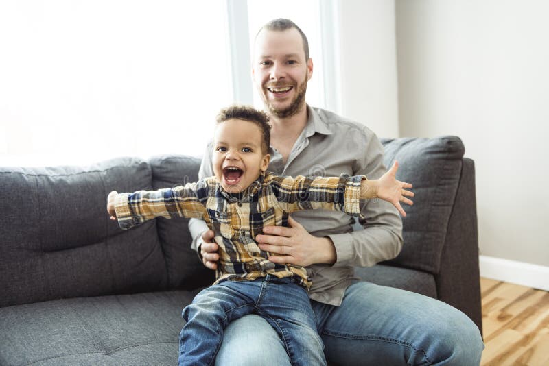 Family with Two Years Son Having Fun on Sofa Together Stock Photo ...