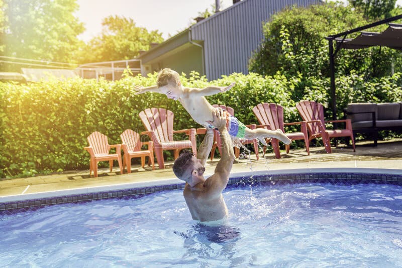 Father and Son Having Fun in Swimming Pool Stock Photo - Image of ...