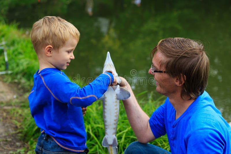 Father and Son Holding Fish they Caught Stock Photo - Image of fish ...