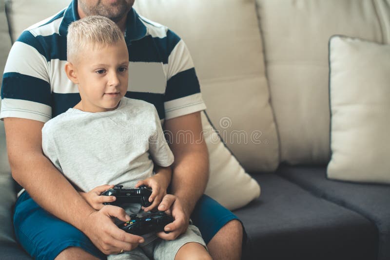Father with Son with Joystick Controllers in Hands Stock Image - Image ...