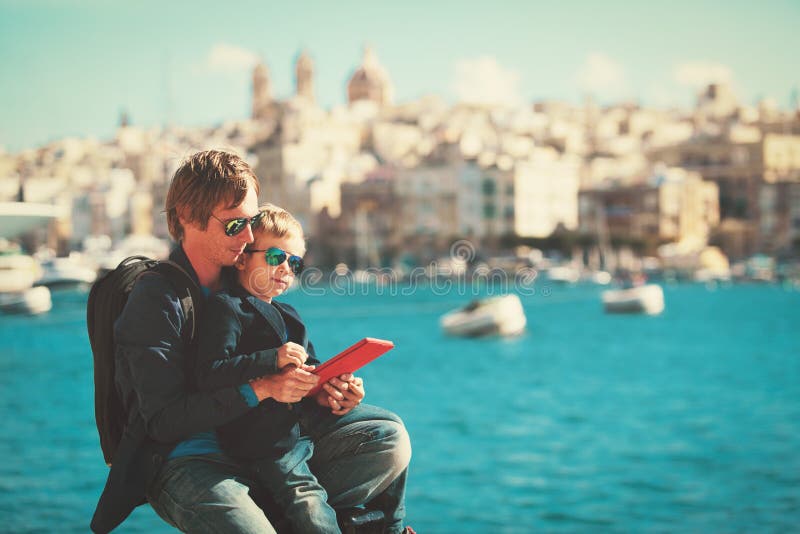 Father and Son Looking at Touch Pad Travel in Malta Stock Photo - Image ...