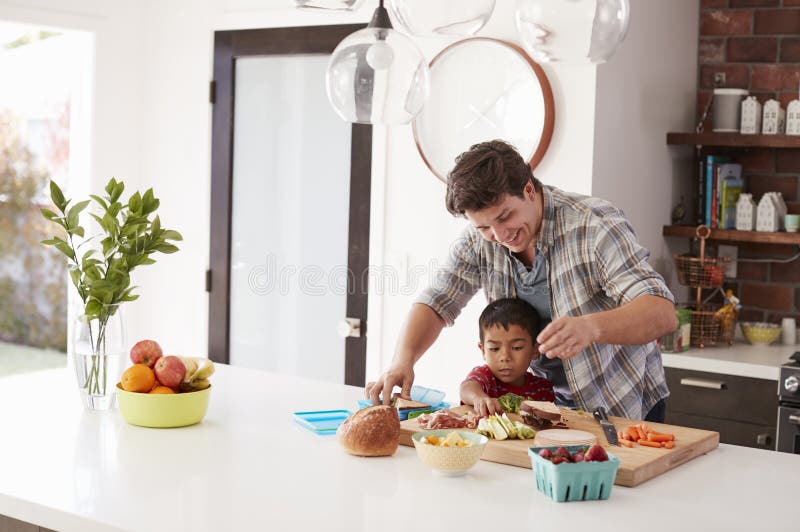 Father and Son Making School Lunch in Kitchen at Home Stock Image ...