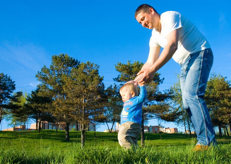 Father and Son in the Meadow Stock Photo - Image of baby, parent: 24587022