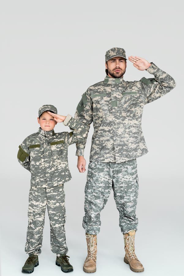 Father and Son in Military Uniforms Saluting and Looking at Camera ...