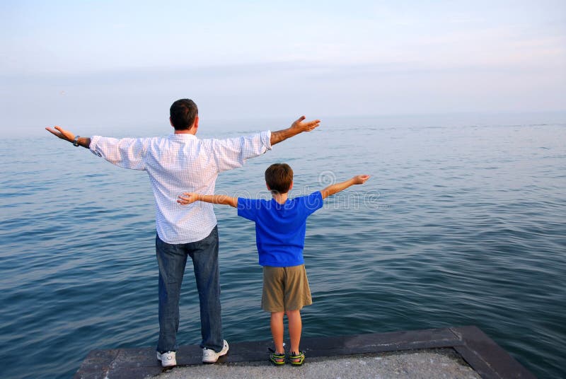 Father son ocean stock image. Image of parenthood, childhood - 1156977