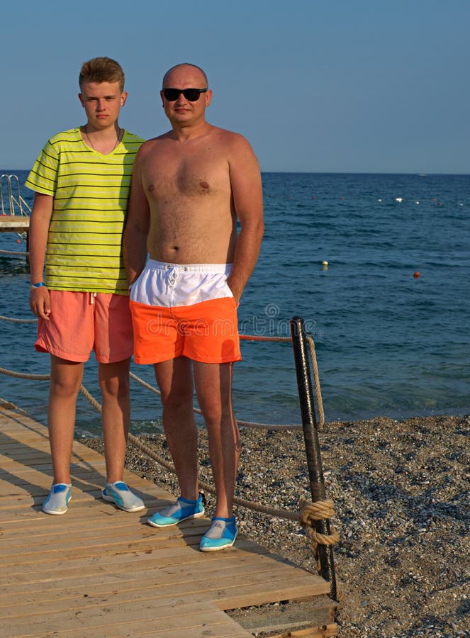 Father with Son on the Pier by the Sea Stock Photo - Image of sean ...