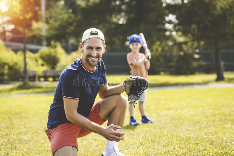 Father and Son Playing Baseball in Sunny Day at Public Park Stock Photo ...