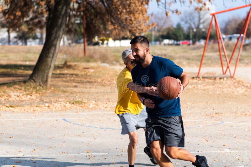 Father and Son Playing Basketball in Park Stock Photo - Image of ...