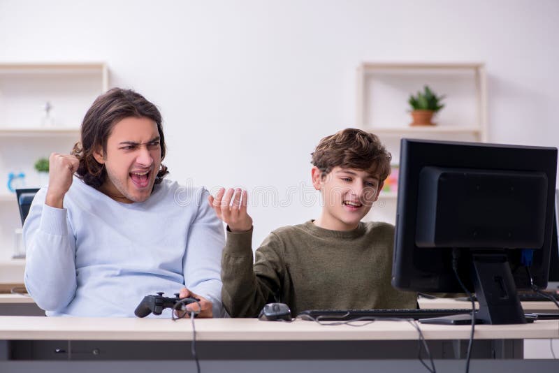 Father and Son Playing Computer Games Stock Photo - Image of controller ...