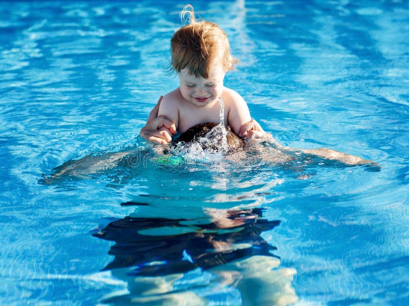 Father and Son Playing in the Pool Stock Image - Image of lifestyle ...