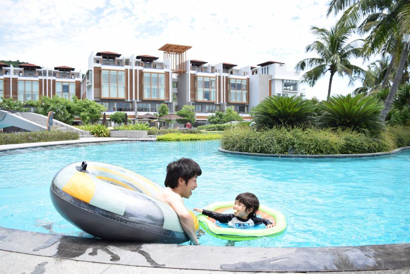Father and Son Playing at Summer Pool Stock Photo - Image of summer ...