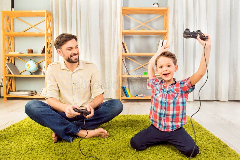 Father and Son Playing Video Games. Son Winning Stock Image - Image of ...