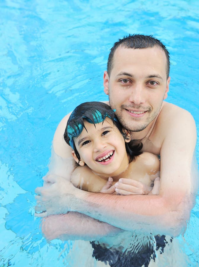 Father son pool stock photo. Image of cool, child, holiday - 1095030
