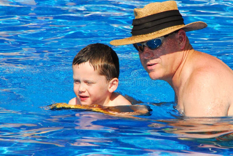Father and son in pool stock photo. Image of summer, swim - 9954904